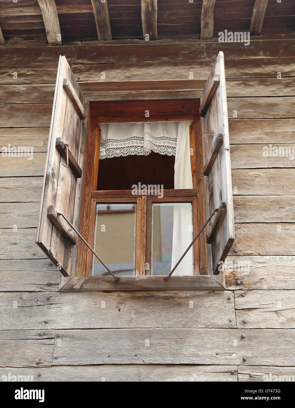 Window of a old wooden house with shutters Stock Photo - Alamy