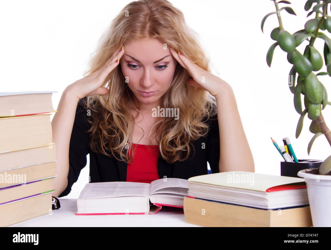 Stressed student girl with pile of books isolated Stock Photo - Alamy