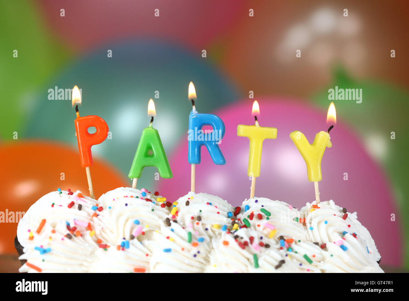Celebration with Balloons Candles and Cake Stock Photo - Alamy