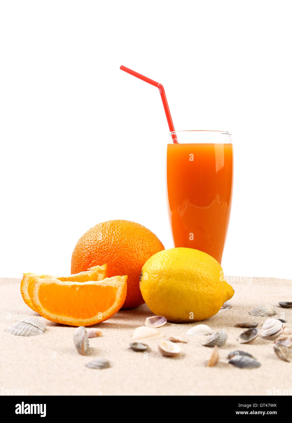 Juice, orange, lemon, shells on sand Stock Photo - Alamy