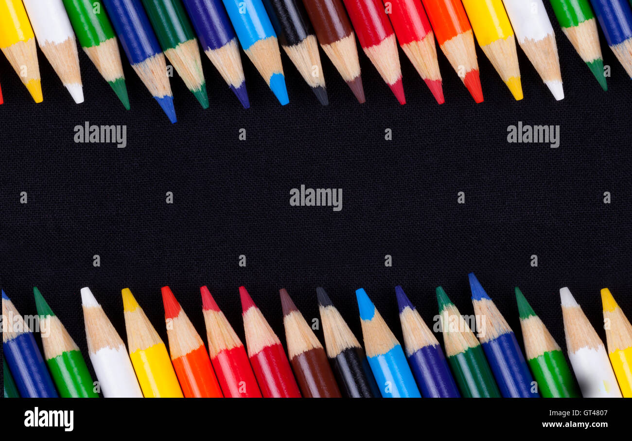Color pencils isolated on black background Stock Photo - Alamy