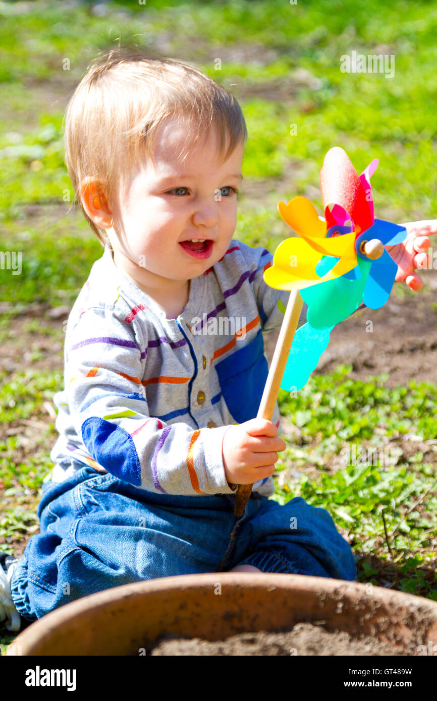 Boy Playing With Wind Toy Stock Photo - Alamy