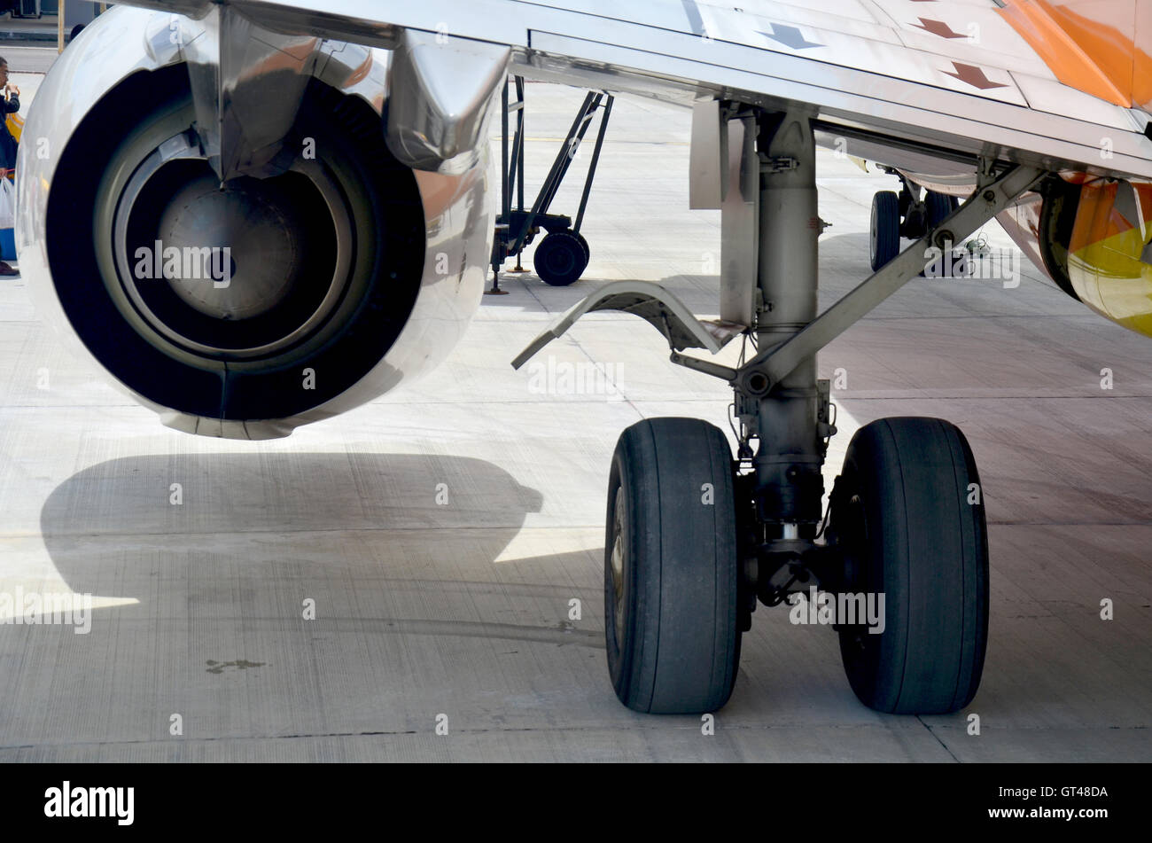Jet engine and wheel of airplane stop at Trang International Airport in ...