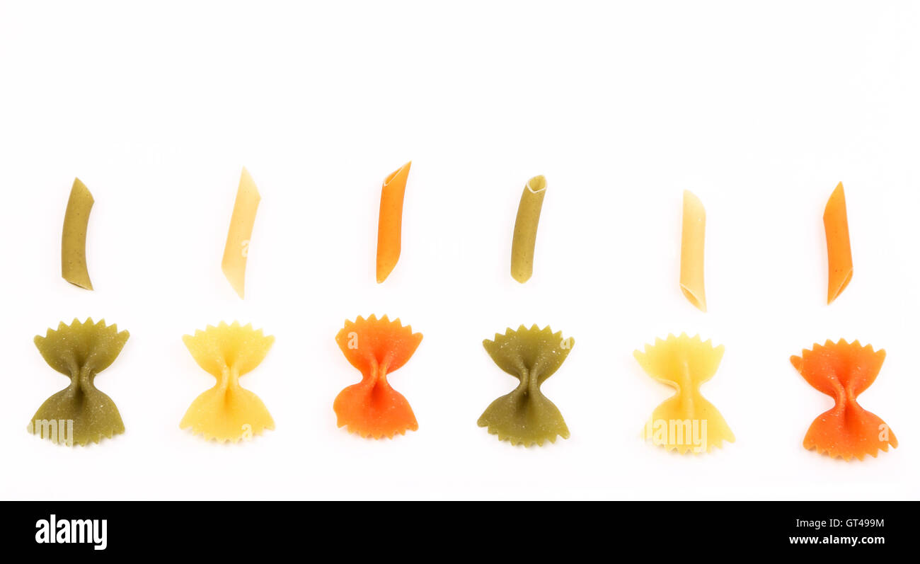 Composition of different pasta in three colors Stock Photo - Alamy