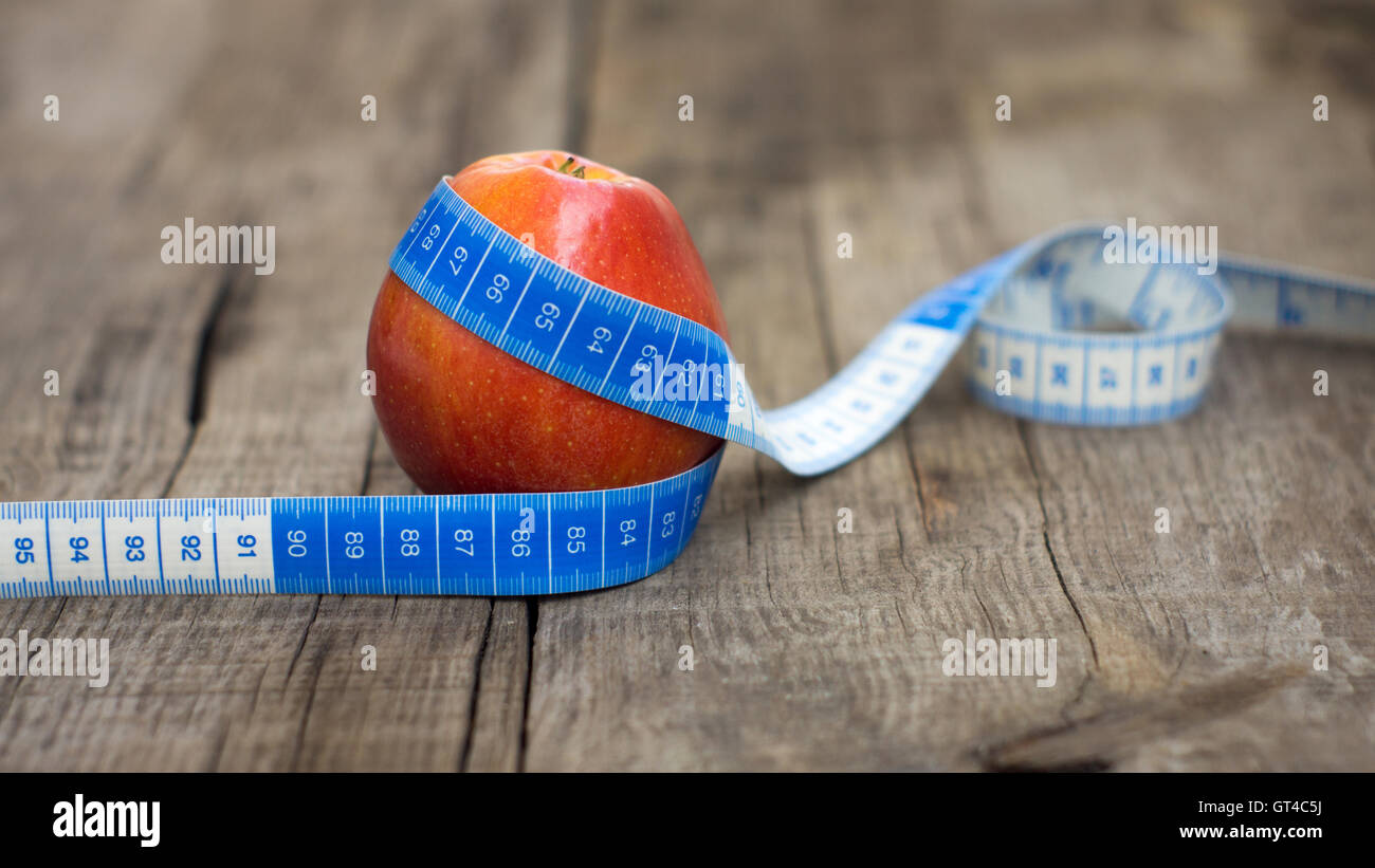 Apple and Measuring tape Stock Photo - Alamy