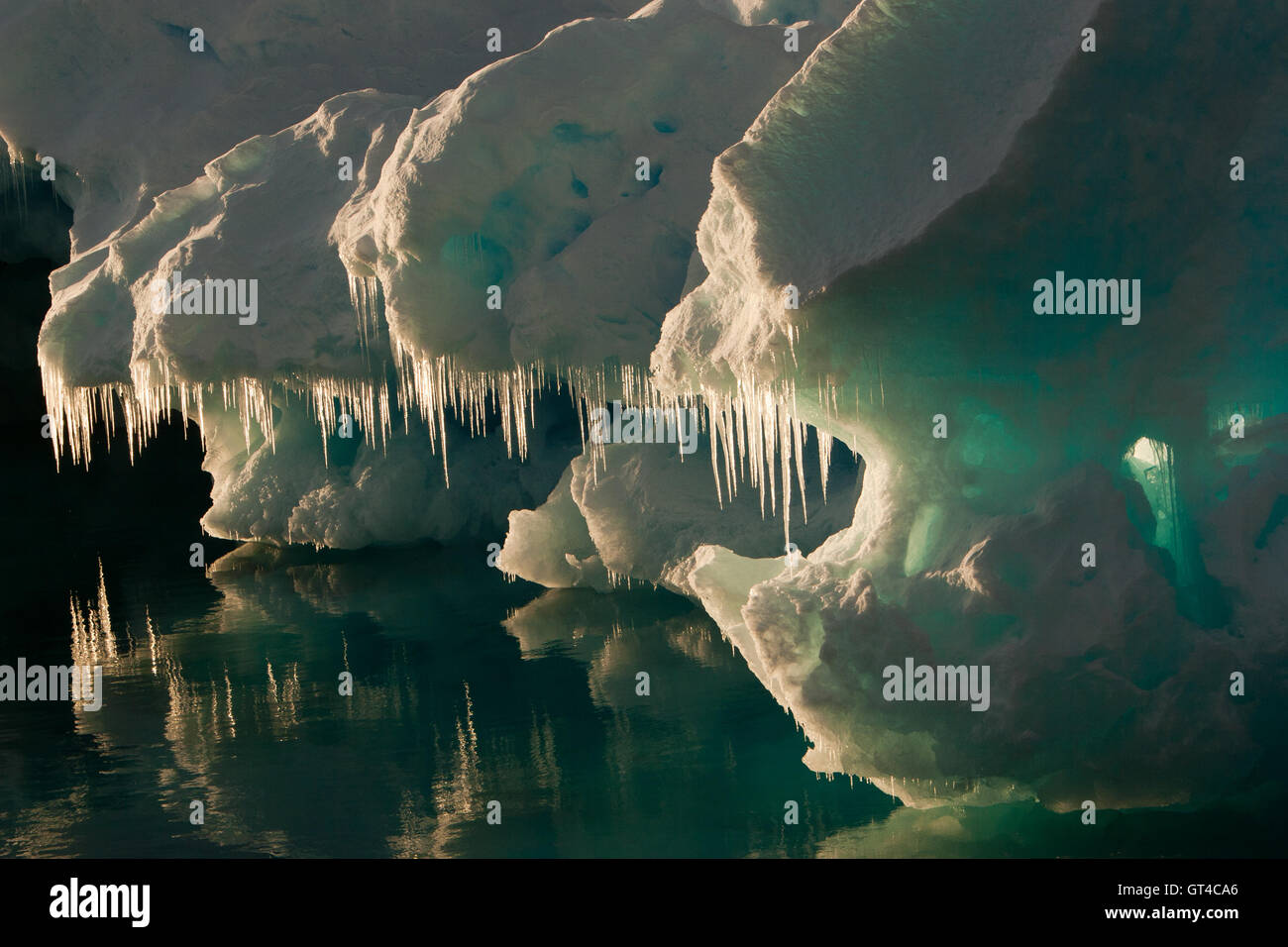 Icicles hang like fangs on an iceberg in Antarctica Stock Photo - Alamy
