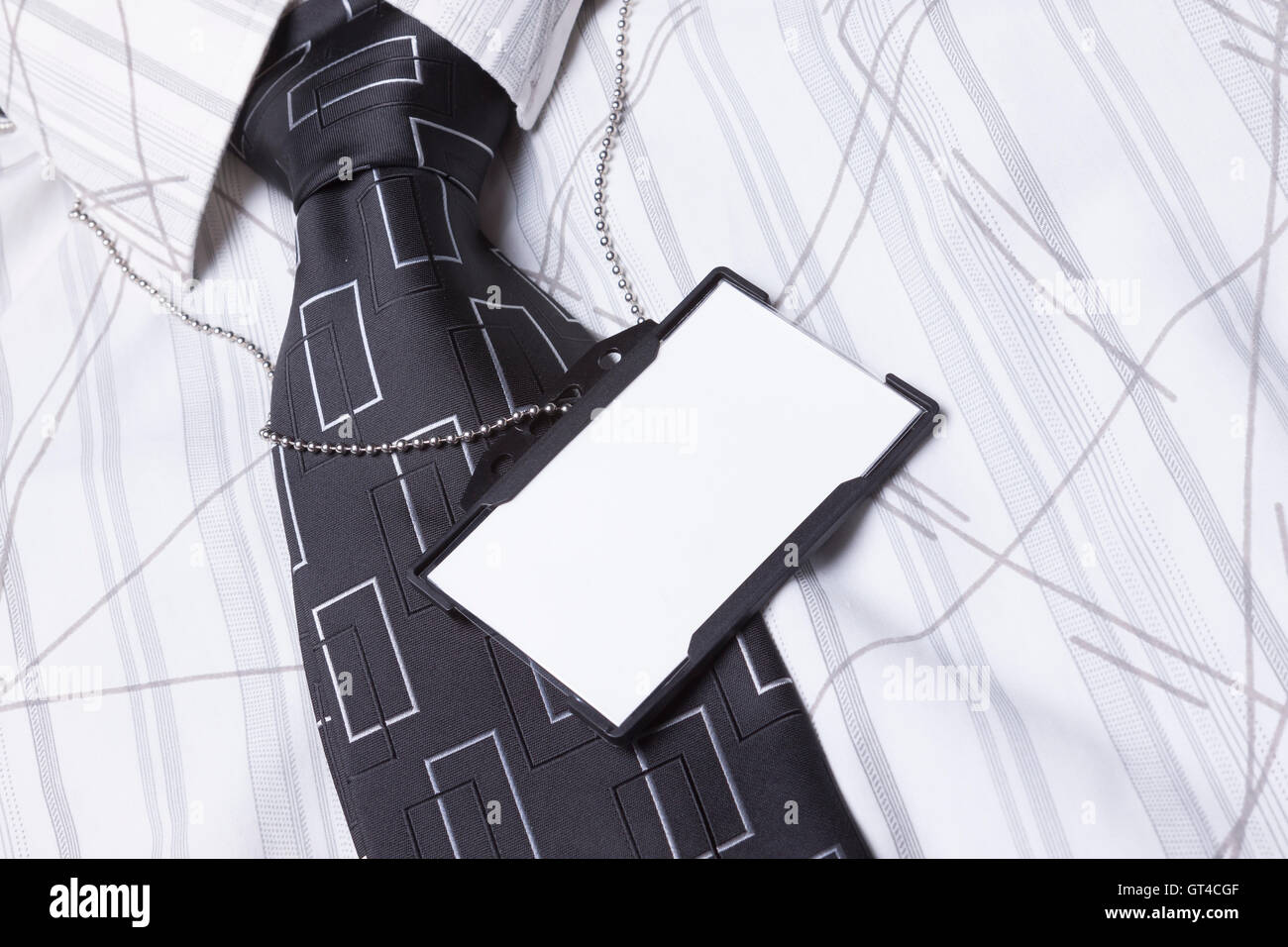 Card empty ID badge on man suit Stock Photo - Alamy