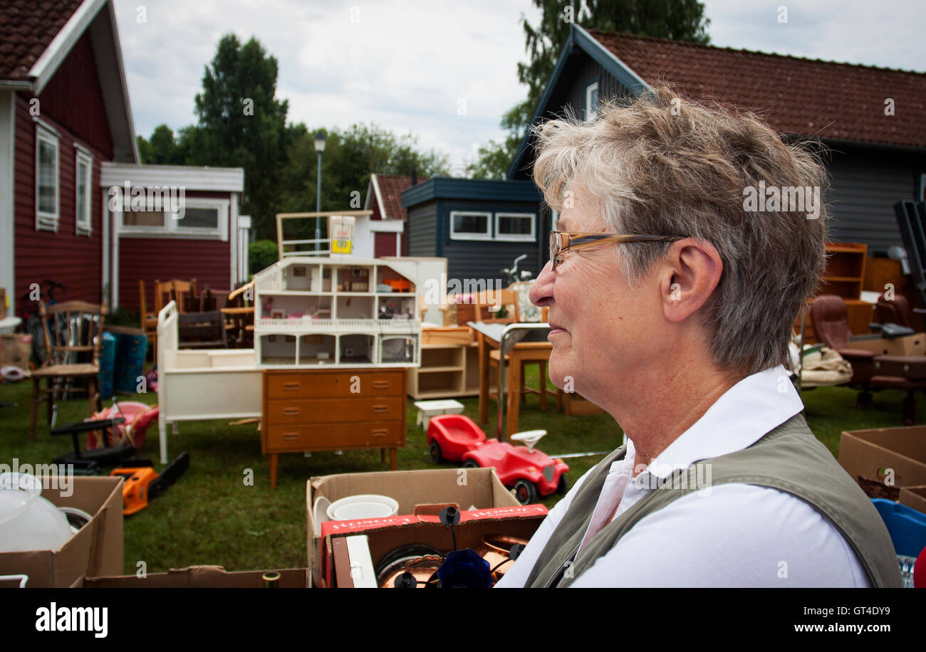 Senior woman at auction Stock Photo - Alamy