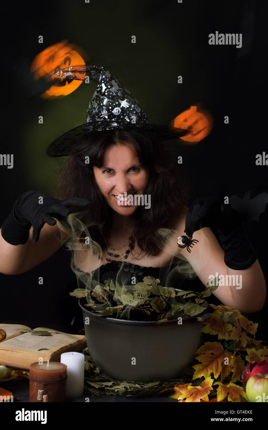 Witch making magic Stock Photo - Alamy