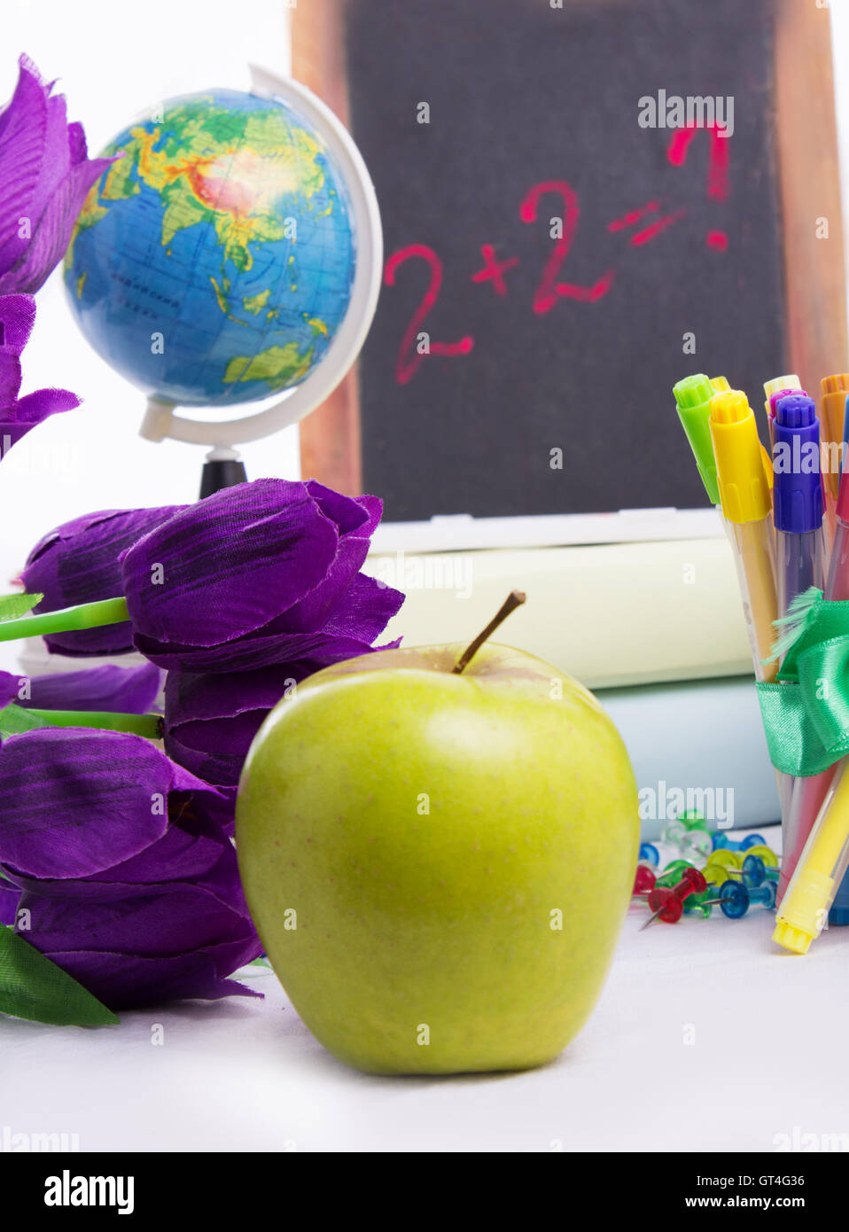 Back to school concept with flowers and apple Stock Photo - Alamy