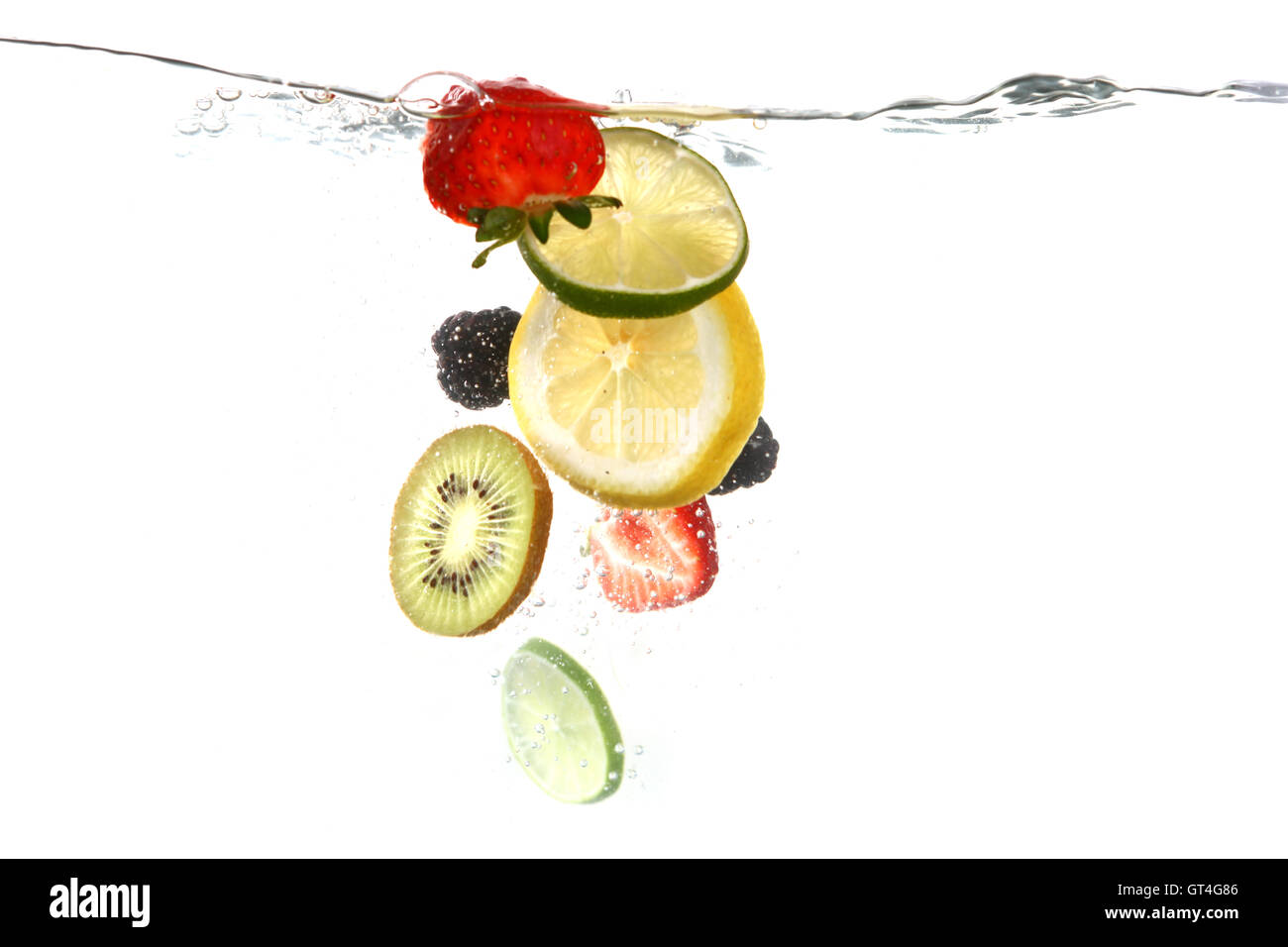 Fruits Falling Into Splashing Clear Water Stock Photo - Alamy
