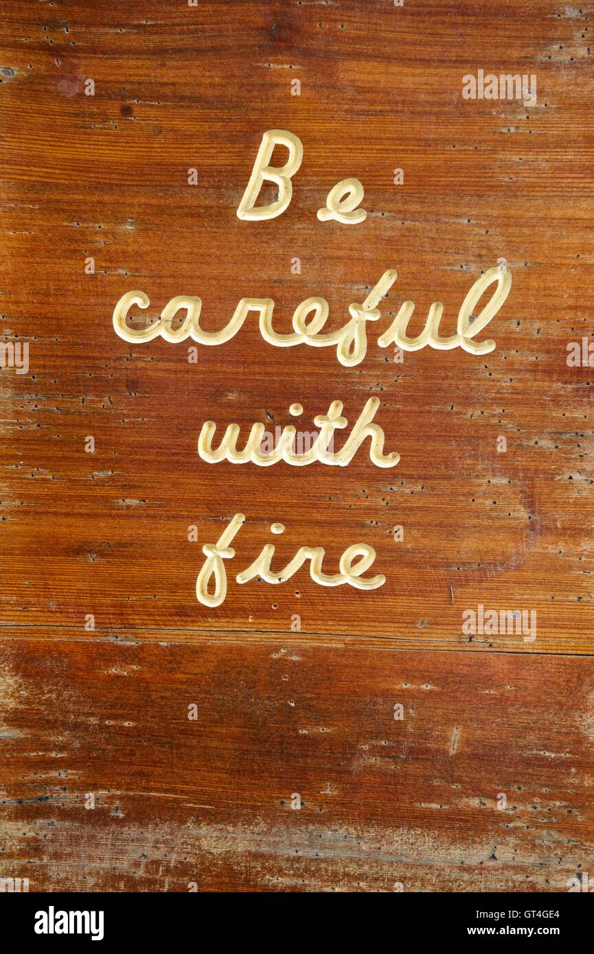 Be Careful With Fire Wooden Sign Stock Photo - Alamy