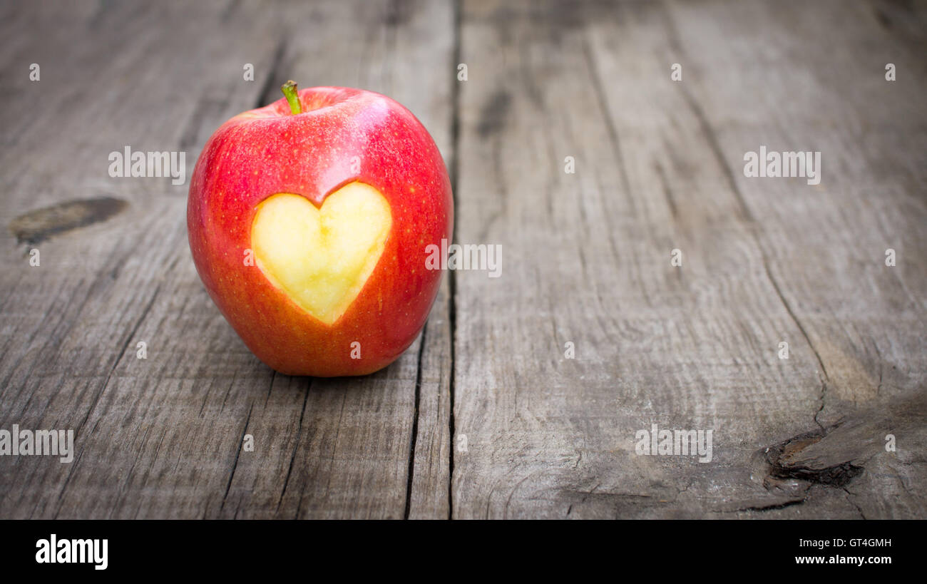 Apple with engraved heart Stock Photo - Alamy