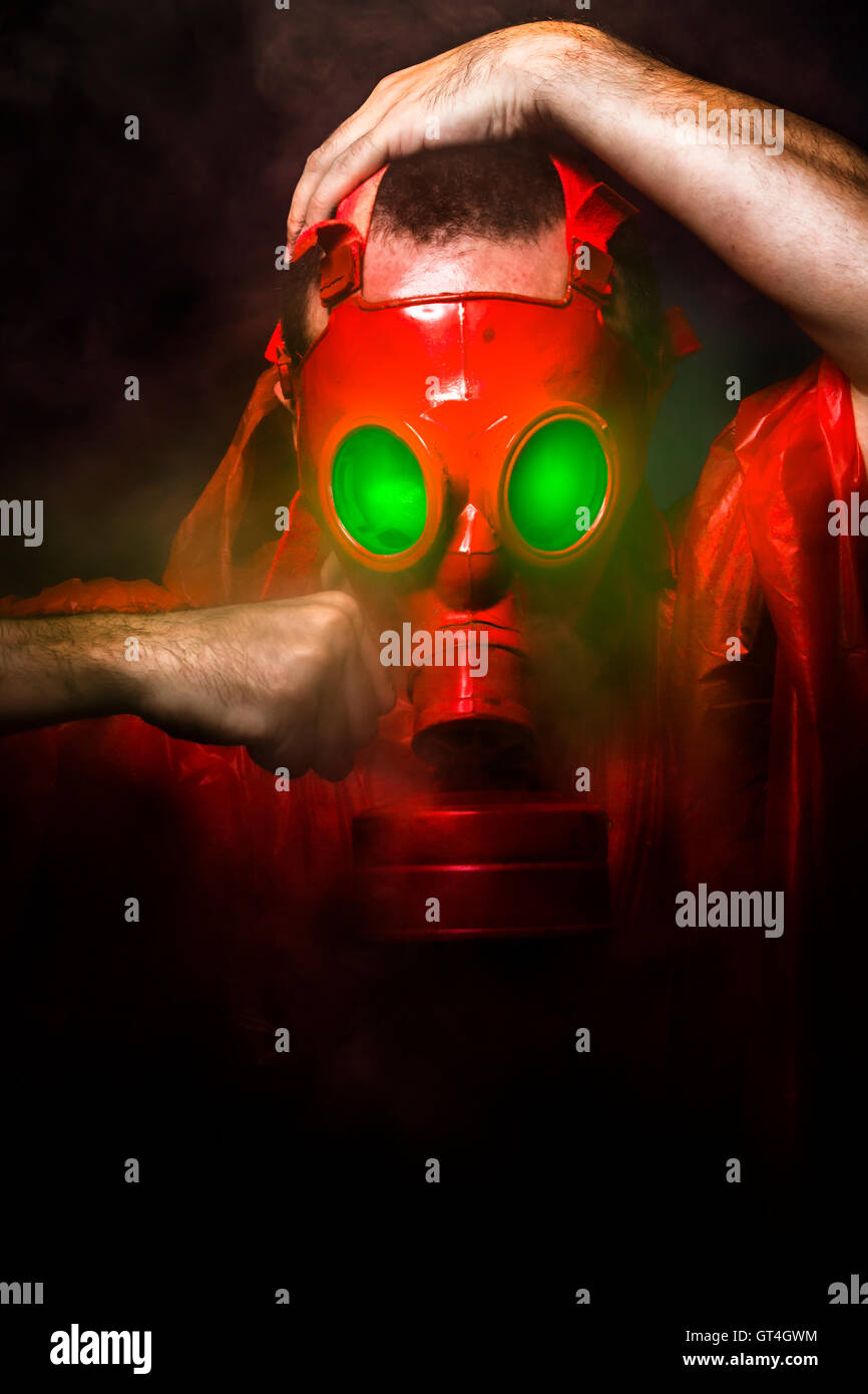 Toxic horror concept, man with red gas mask Stock Photo - Alamy