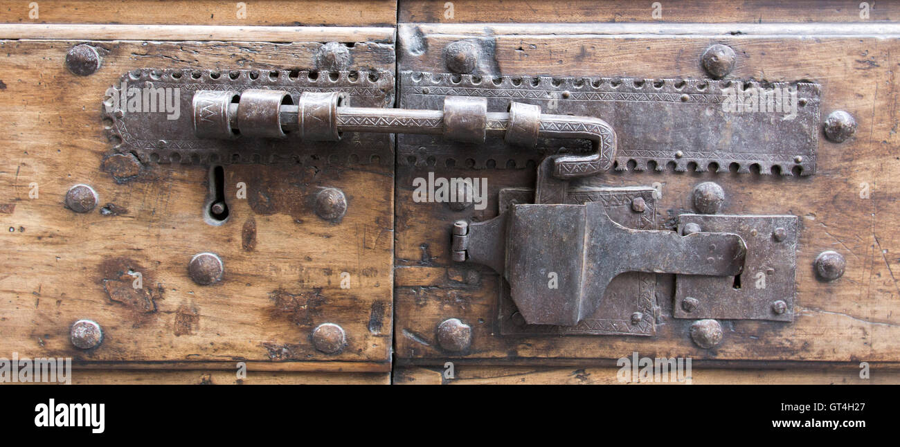 ancient lock in a big wooden door of the medieval castle Stock Photo ...