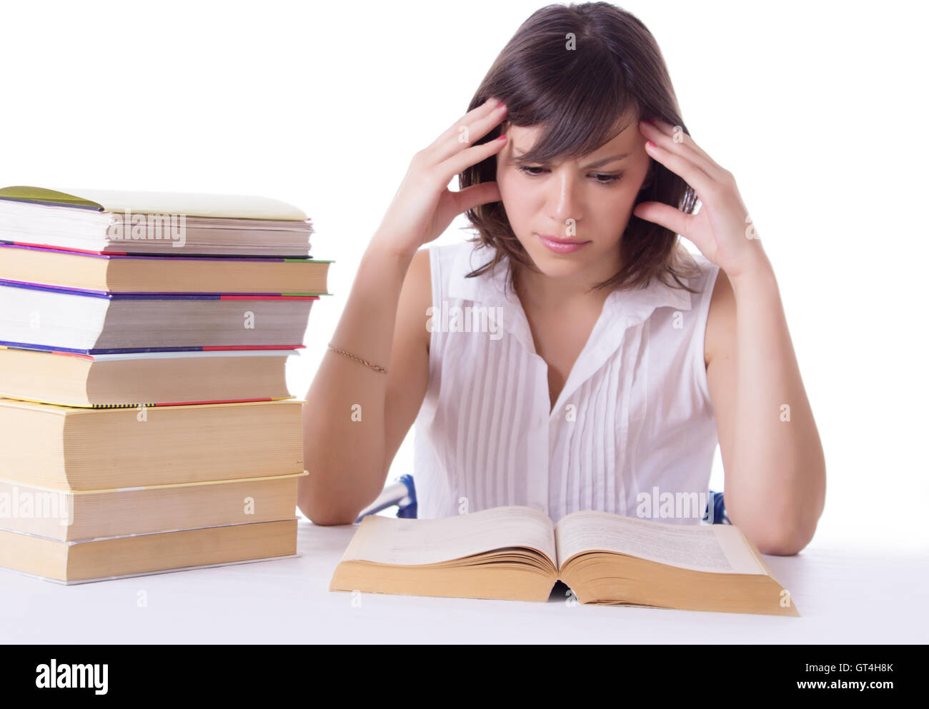 Concentrated student girl reading books Stock Photo - Alamy