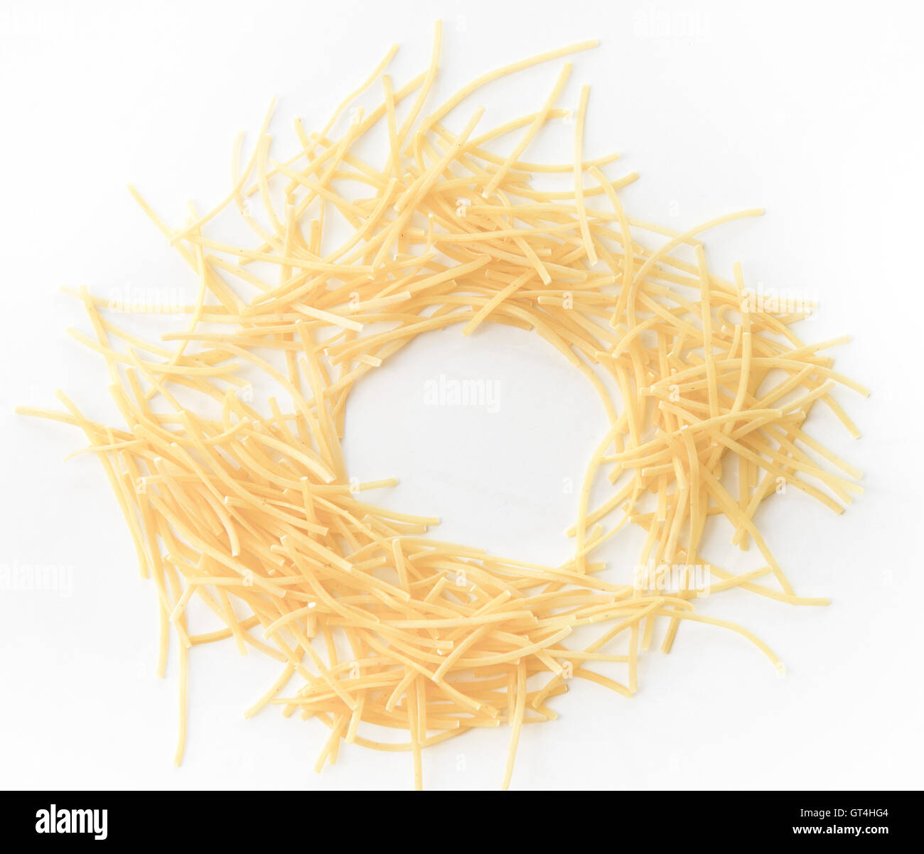 Small dry pasta noodles on white background Stock Photo - Alamy