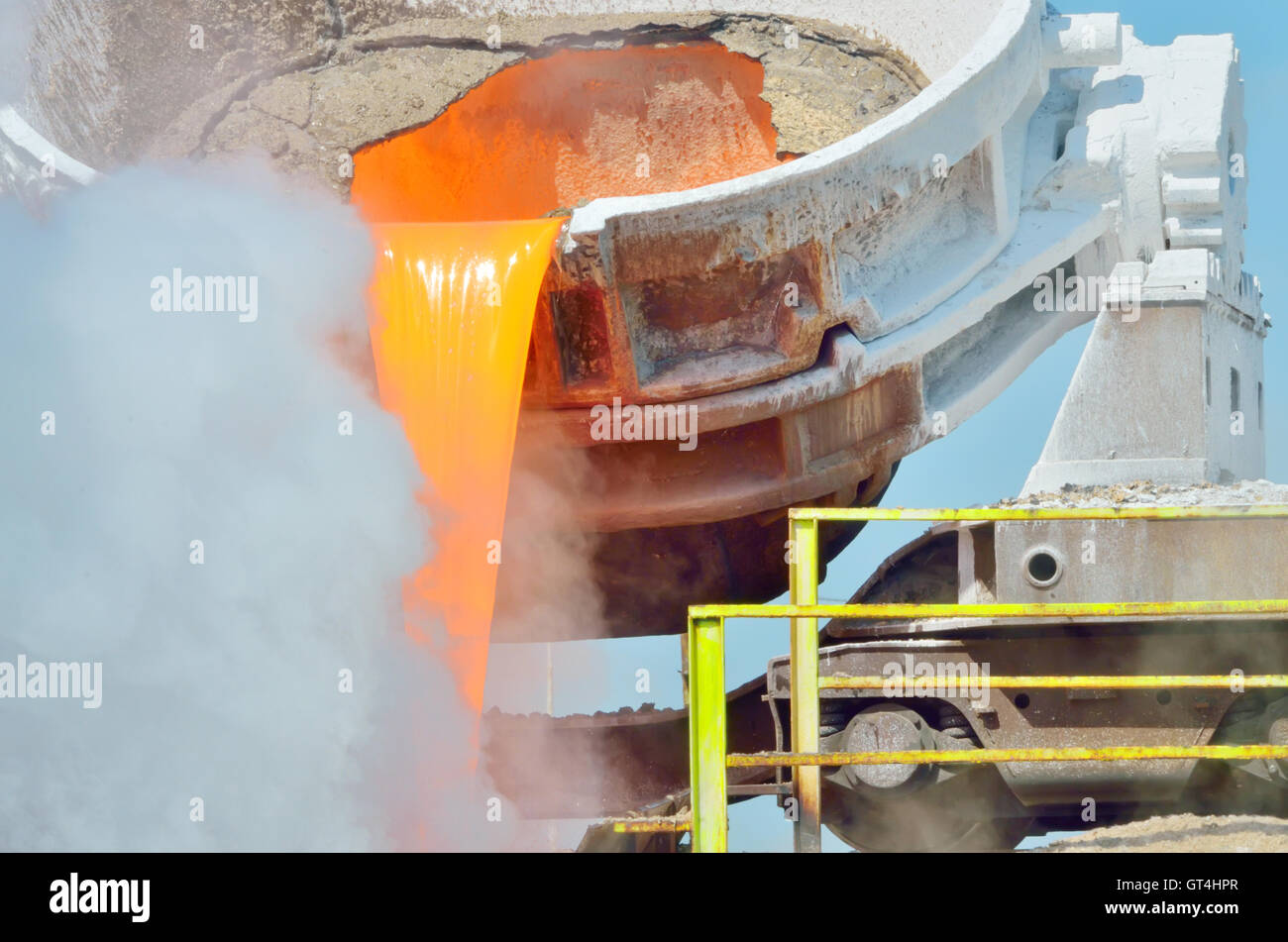 The molten slag is poured from a cup Stock Photo - Alamy