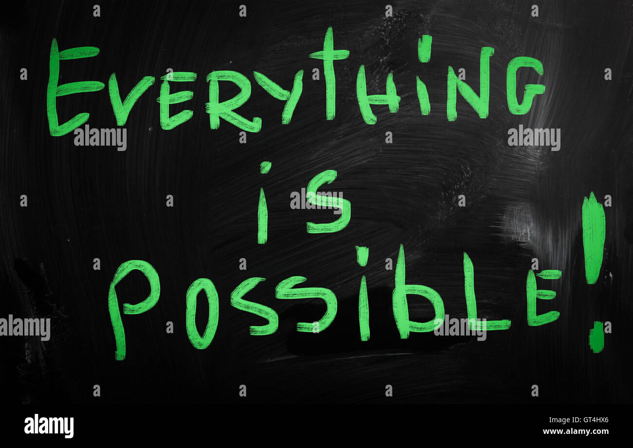 Everything is possible handwritten with white chalk on a black Stock ...