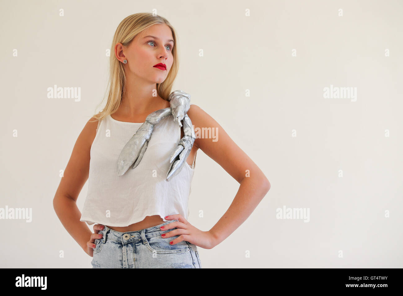 A young woman presenting the wearable object 'Hummer' (2013) by Juliane ...