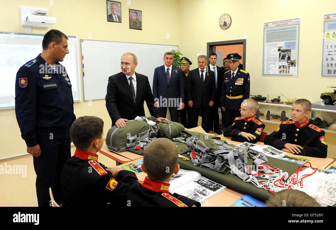 Russian President Vladimir Putin visits a class on parachute packing ...