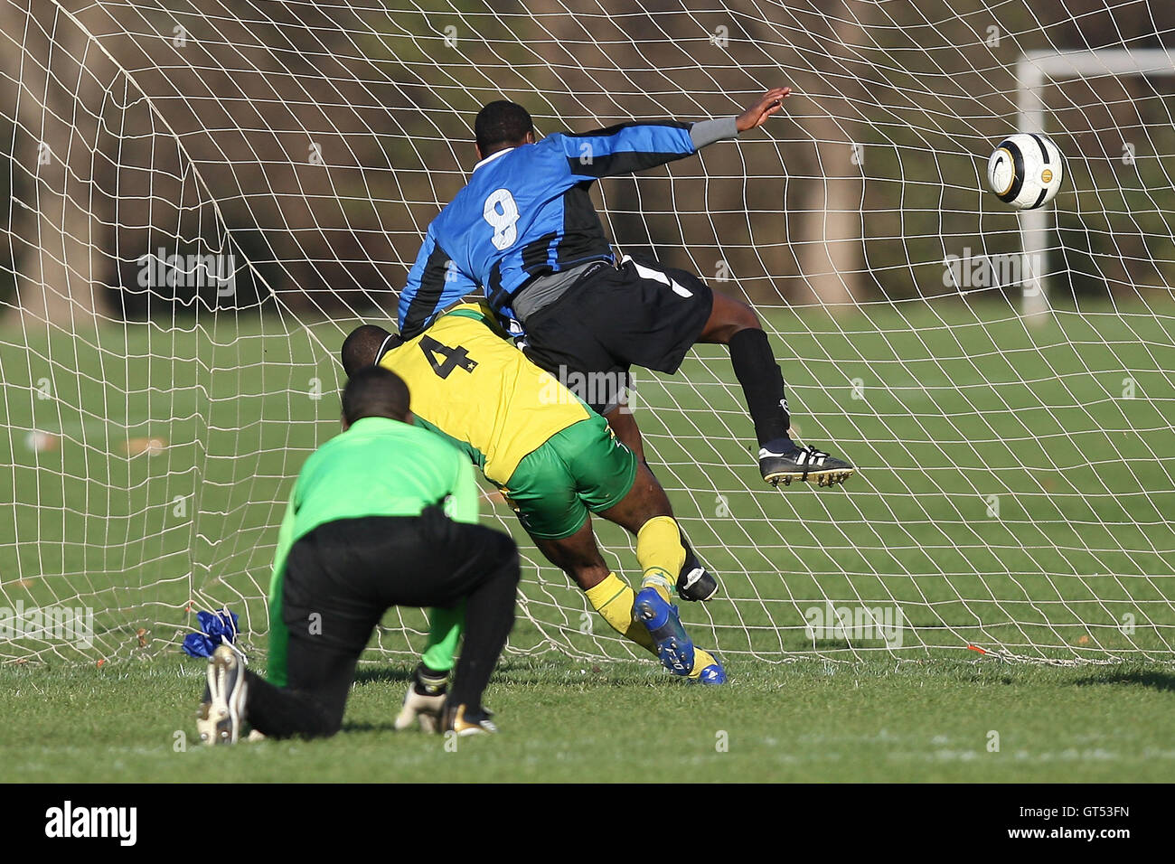 Hacknery Borough score their fourth goal - Black Meteors (yellow/green ...