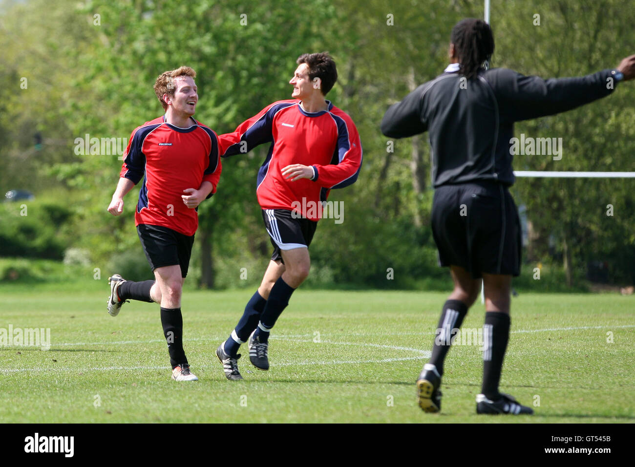 Top Red celebrate scoring a goal - Bocca Albion (blue) vs Top Red (red ...