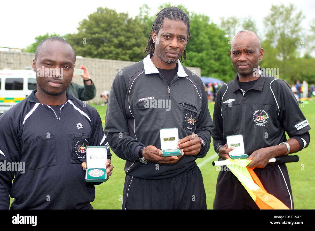 The match officials with their medals - Bocca Albion (blue) vs Top Red ...