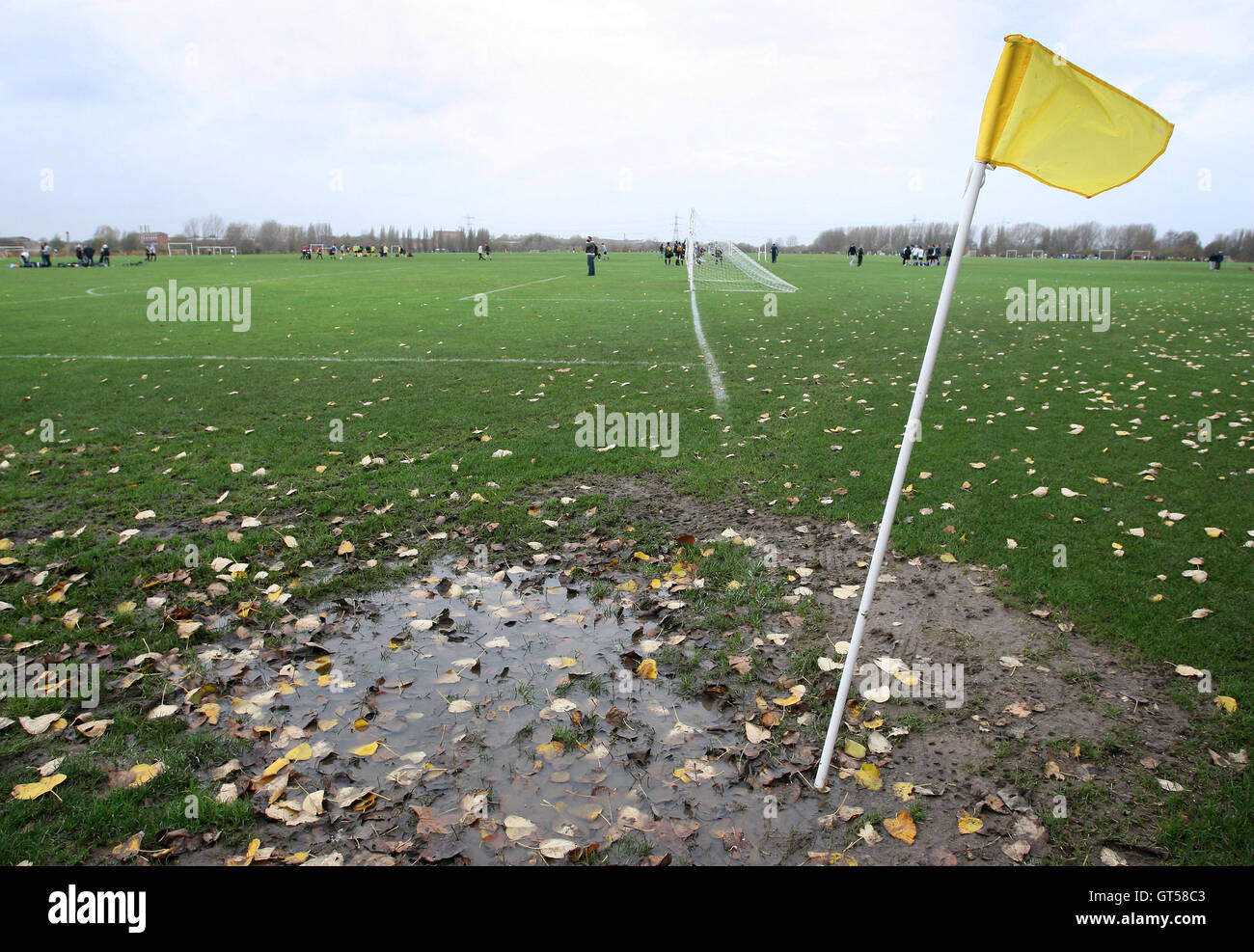 A corner flag is seen in a puddle after heavy rain at South Marsh ...