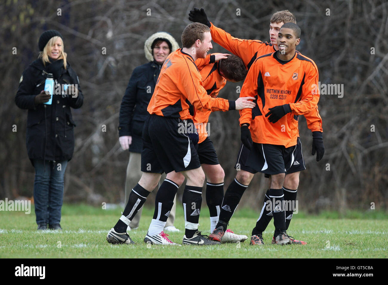 FC Metwin celebrate their third goal - FC Metwin (orange) vs Albion ...