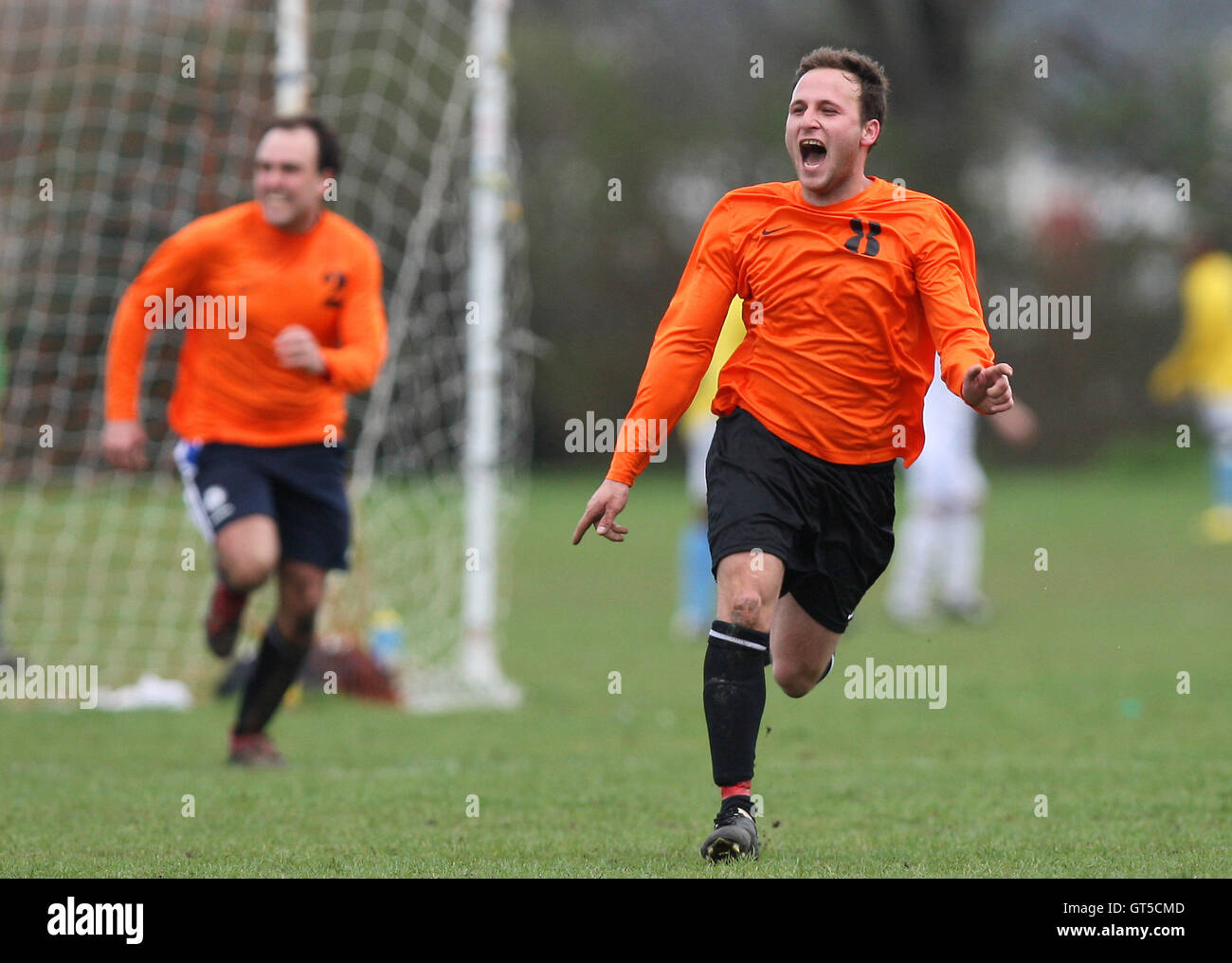 Comet celebrate their third and winning goal - FC Polit (yellow) vs ...