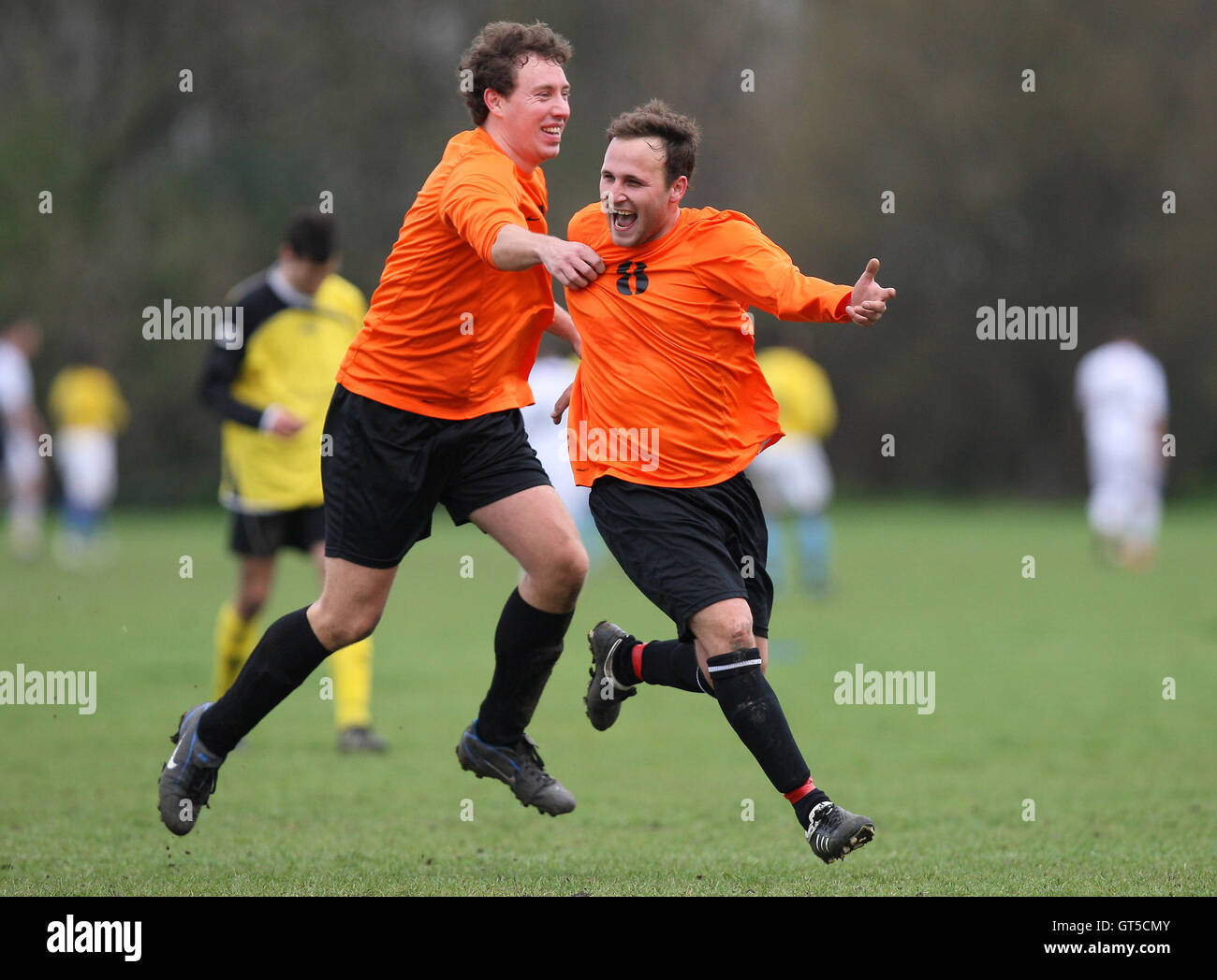 Comet celebrate their third and winning goal - FC Polit (yellow) vs ...