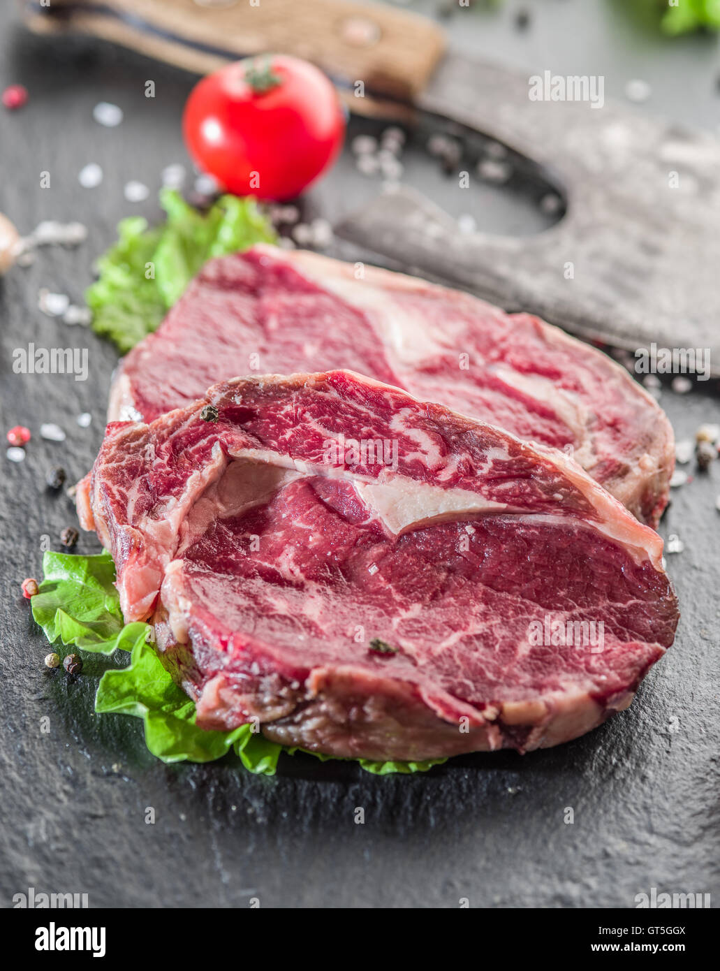 Steak Rib eye with spices on the graphite tray Stock Photo - Alamy