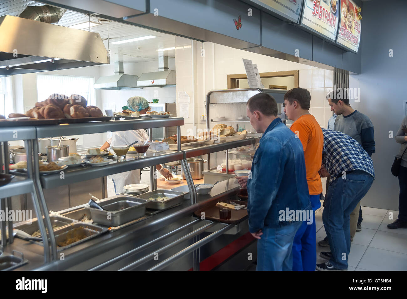 Workers in factory cafe during a lunch break Stock Photo - Alamy