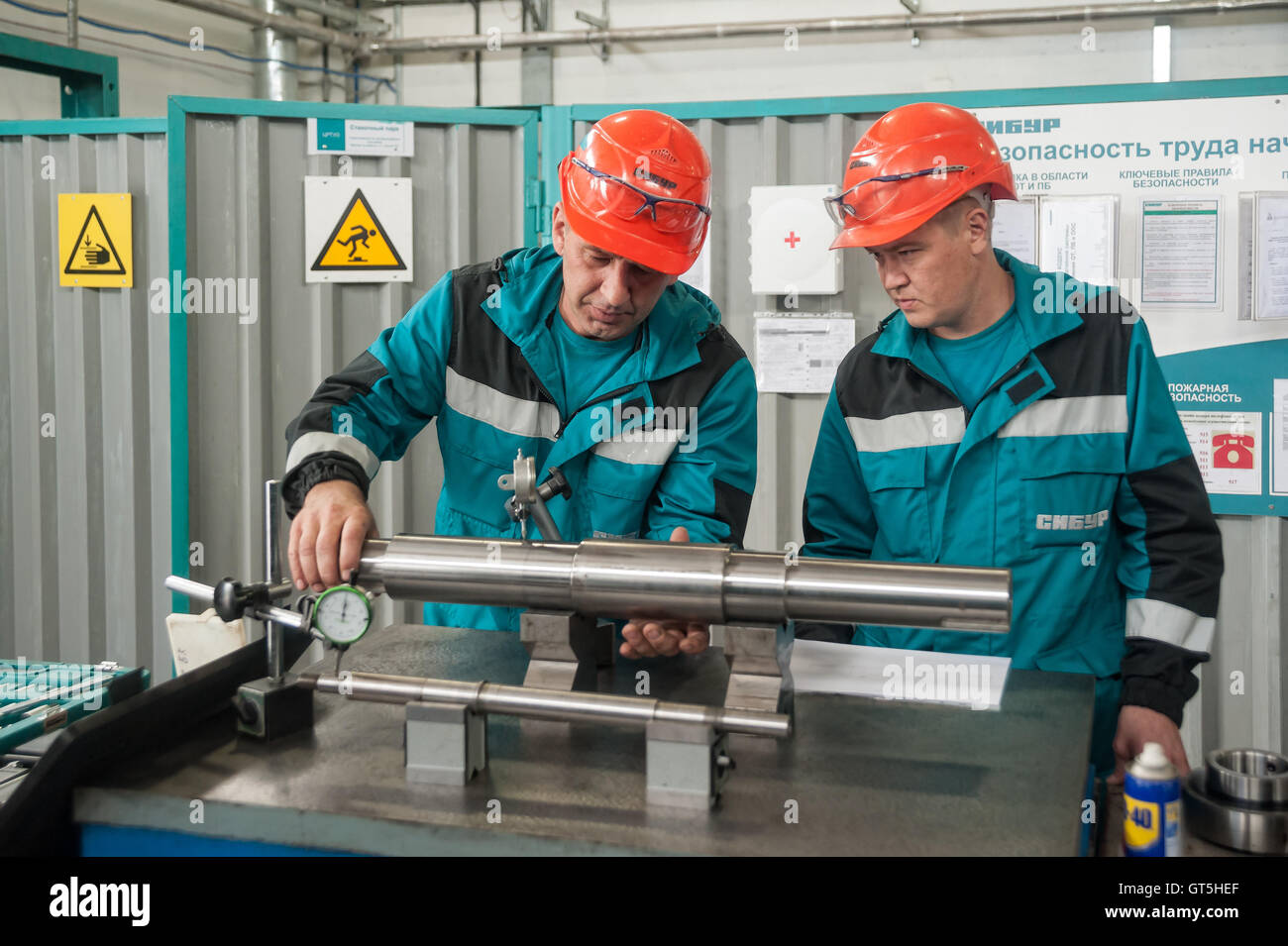 Mechanics carry out adjusting in the workshop Stock Photo - Alamy