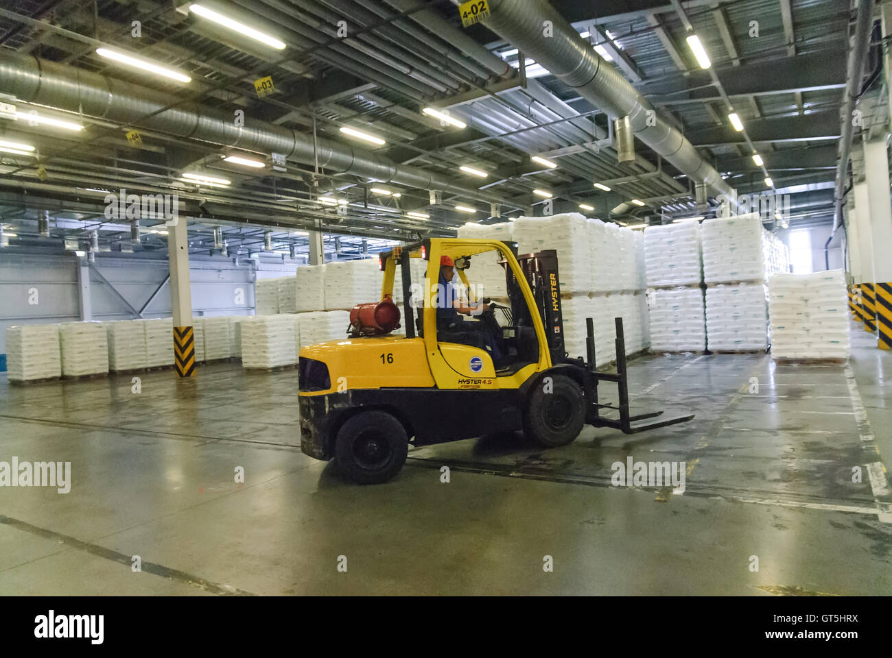 Forklift truck loads pallets with finished goods Stock Photo - Alamy
