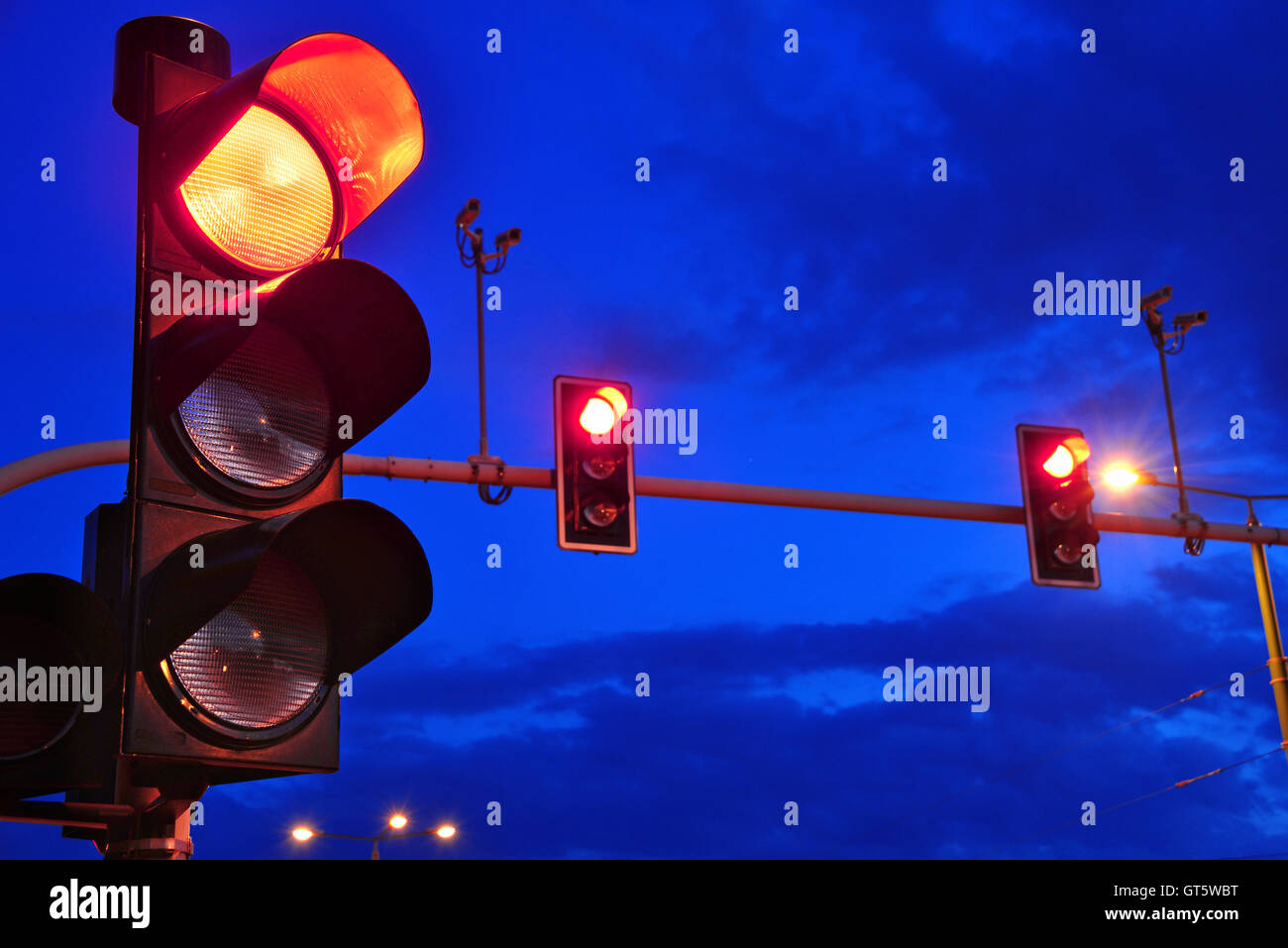 Traffic lights over sky after sunset Stock Photo - Alamy