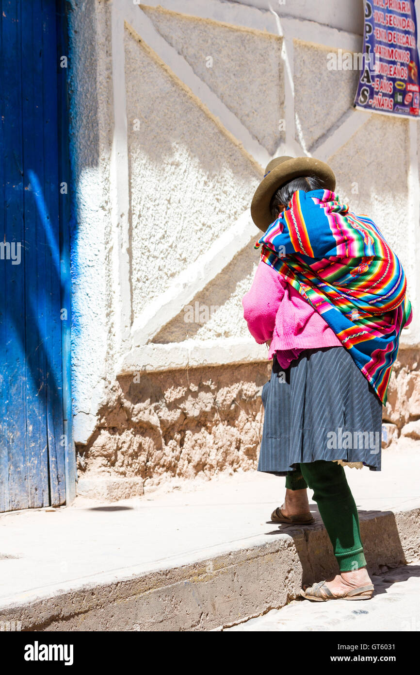 Maras Peru -May 18 : Native Quechua woman with beautiful colors walking ...