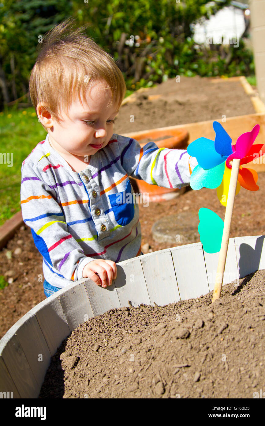 Boy Playing With Wind Toy Stock Photo - Alamy