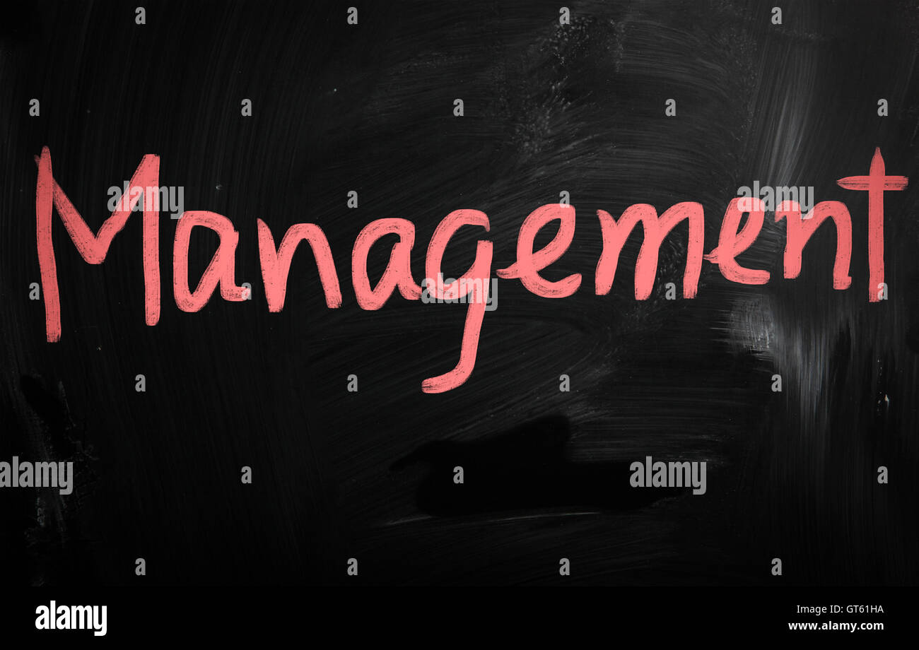 Management handwritten with white chalk on a blackboard Stock Photo - Alamy