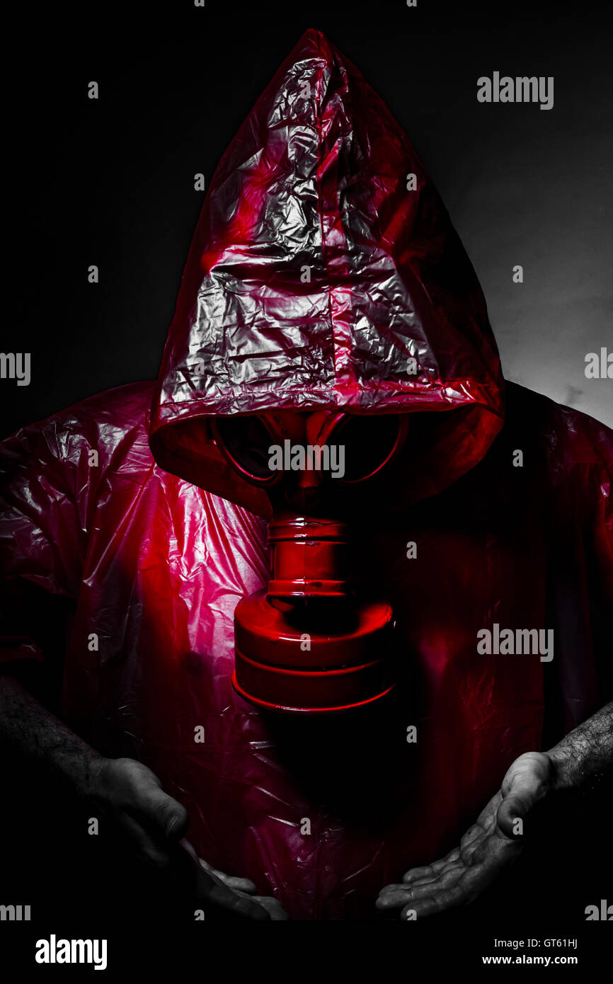 Toxic military concept, man with red gas mask Stock Photo - Alamy