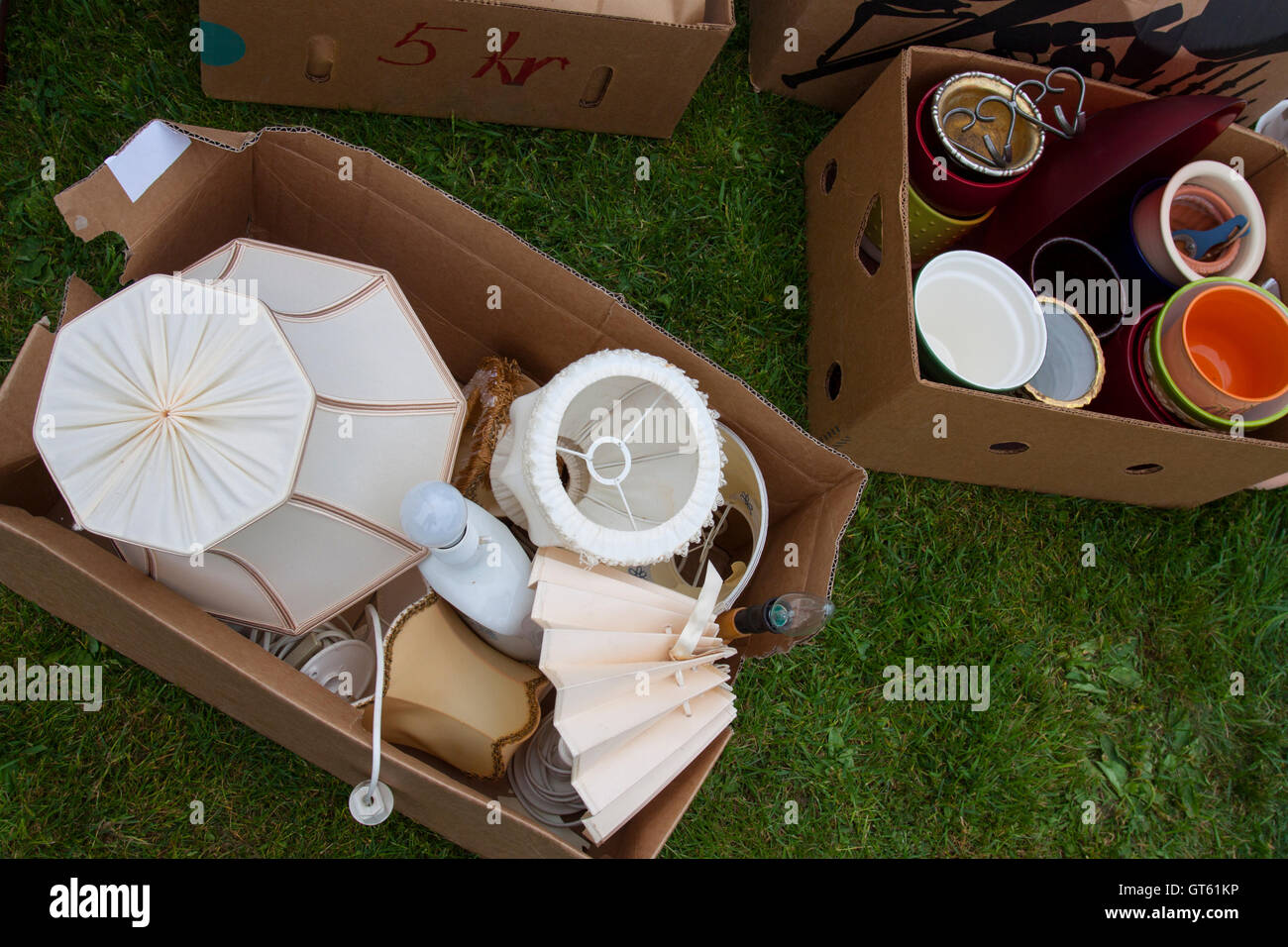Boxes on yard sale Stock Photo - Alamy