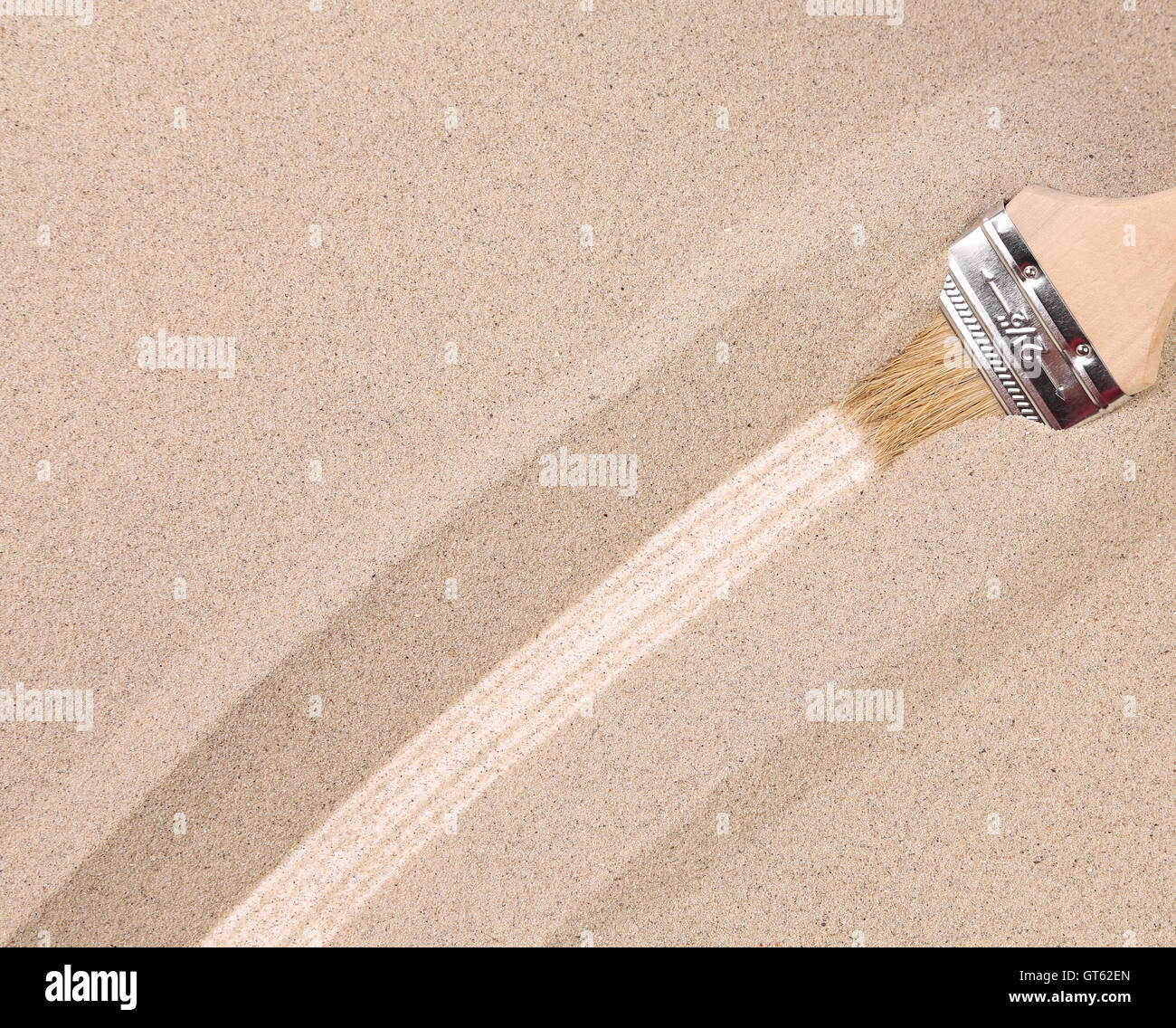Strip in the sand drawn paintbrush Stock Photo - Alamy