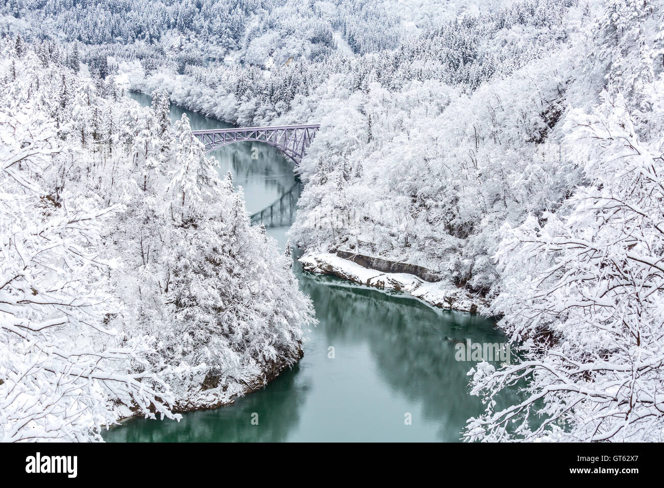 Winter landscape snow covered trees with River and Bridge Stock Photo ...