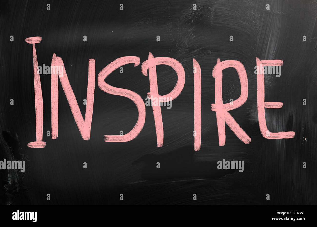 Inspire handwritten with chalk on a blackboard Stock Photo - Alamy