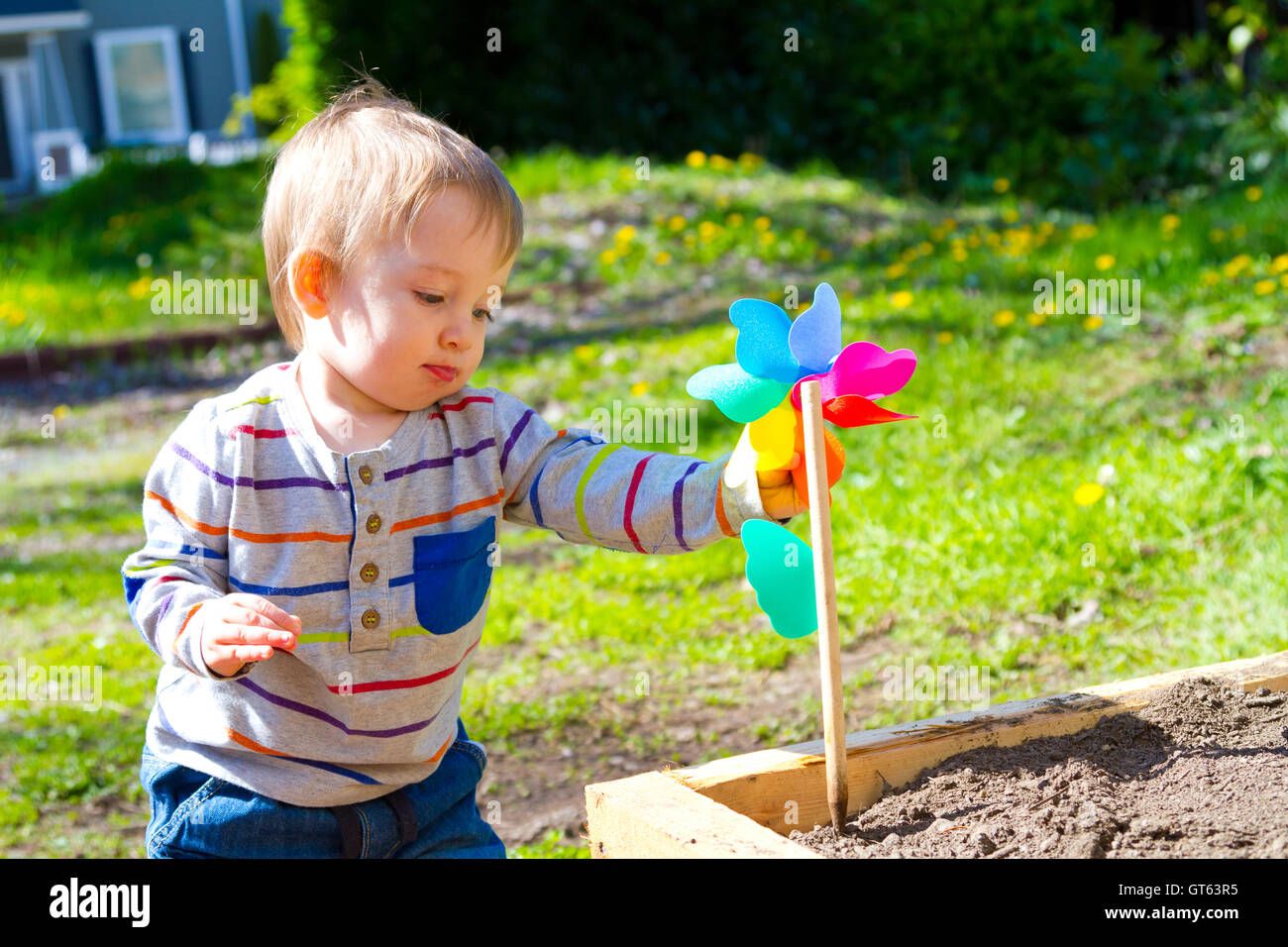 Boy Playing With Wind Toy Stock Photo - Alamy