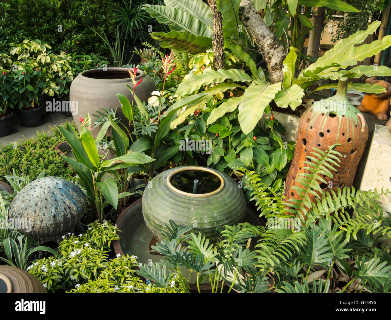 water jar garden Stock Photo - Alamy