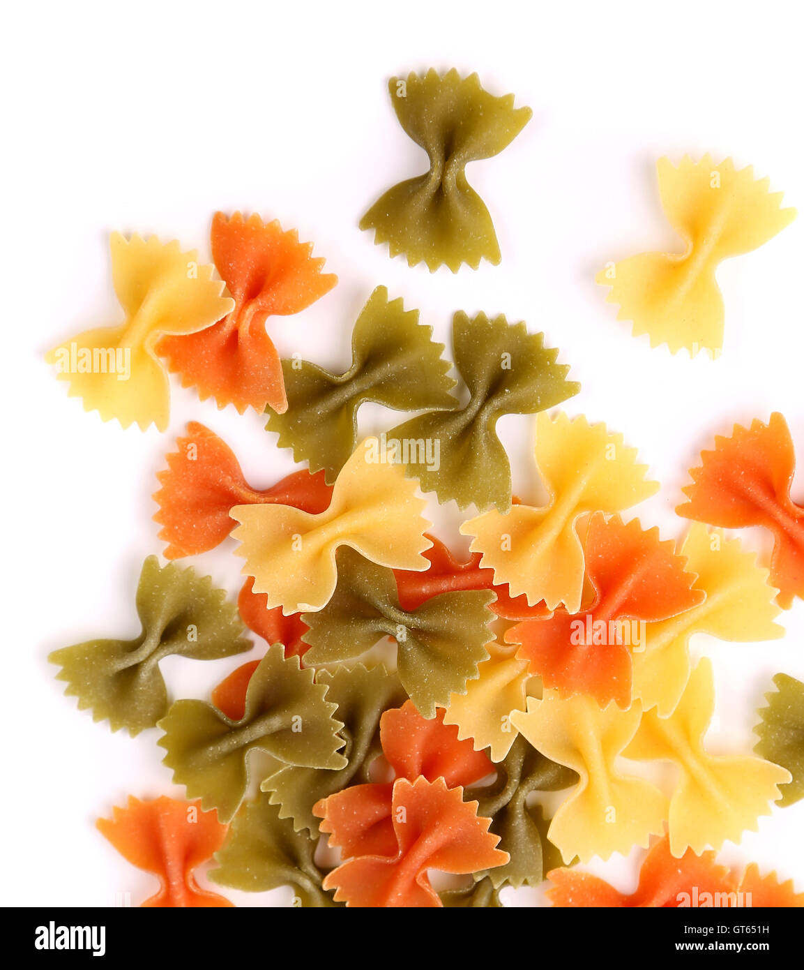 background of the farfalle pasta three colors Stock Photo - Alamy