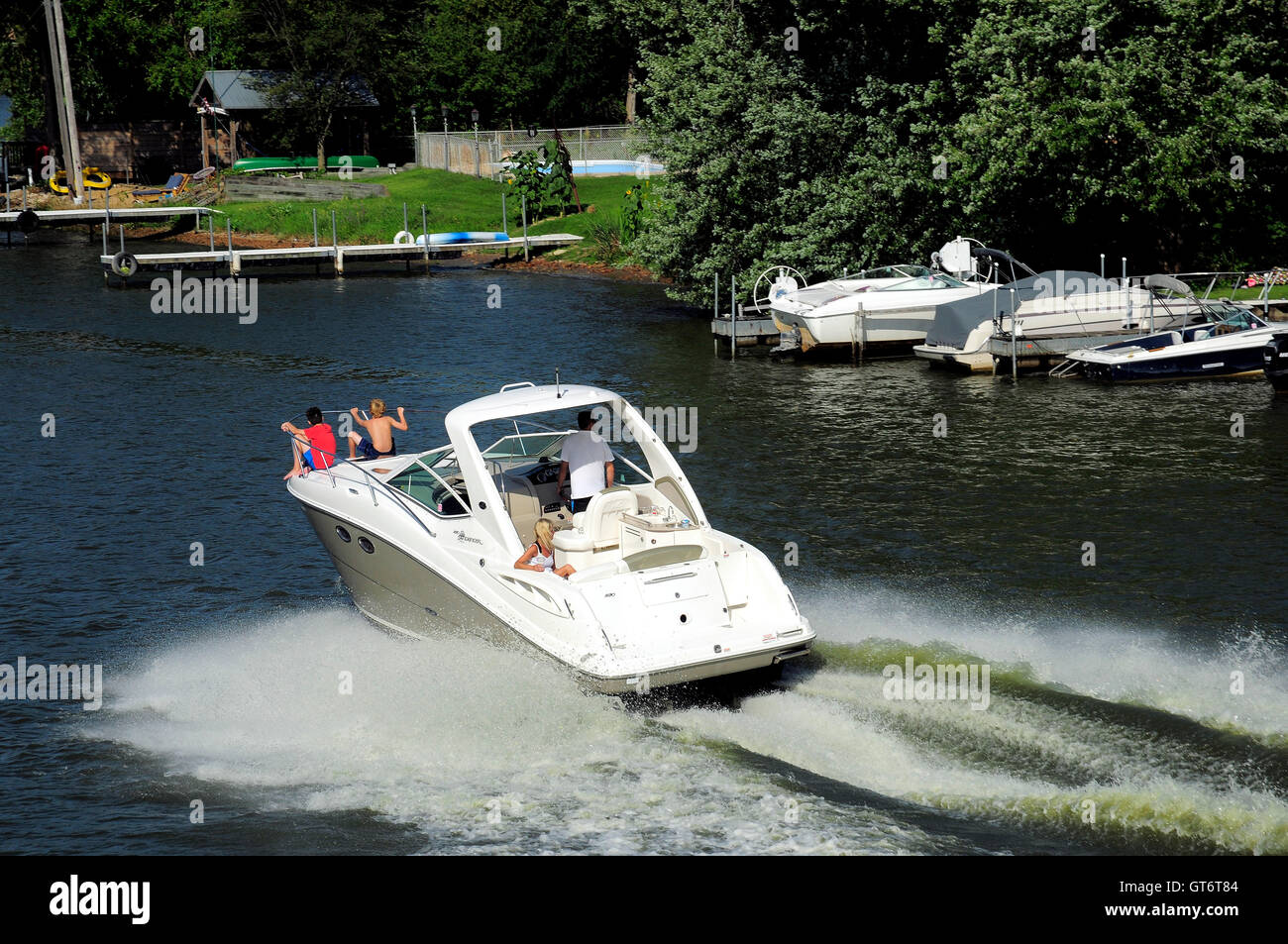 Recreational boating. Kids on bow Stock Photo - Alamy