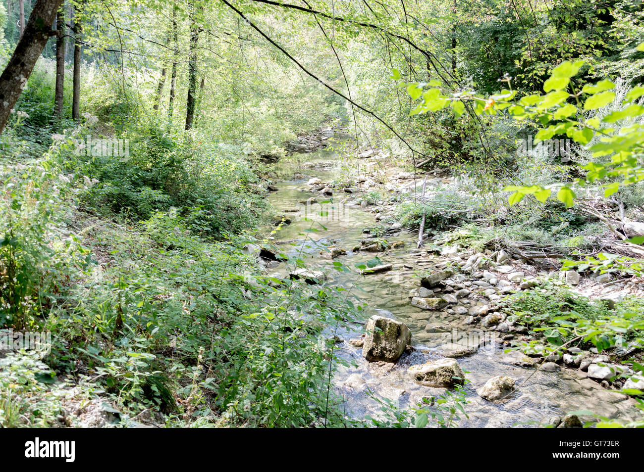 Italy, Tuscany, small river floating in a beautiful landscape on ...